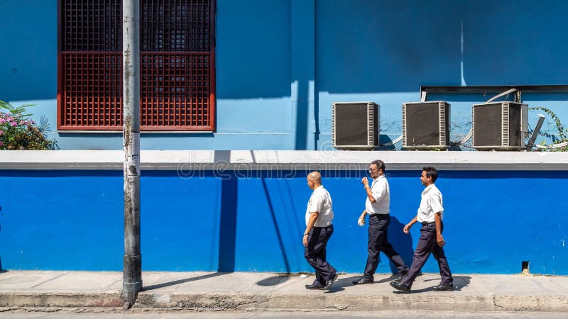 Three Men Walking on a Sidewalk Editorial Image - Image of blue, street ...