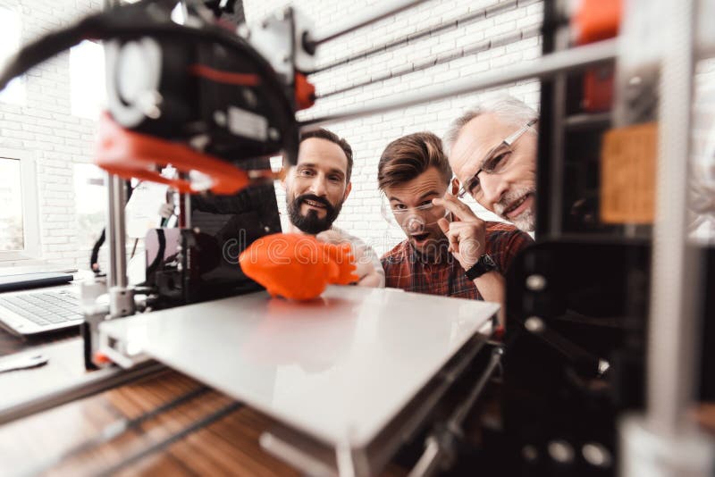 Three Men are Working To Prepare Printed Model on the 3d Model of the ...