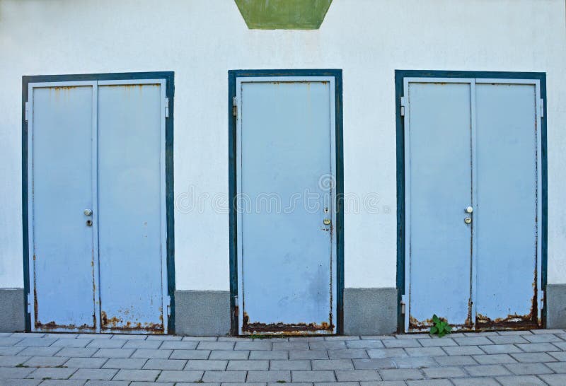 Three metallic blue doors stock image. Image of blue - 292816665