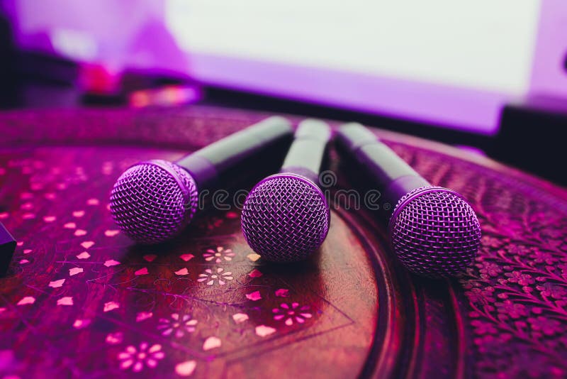Three Microphones in Group on Red Table with Copy Space. Stock Photo ...