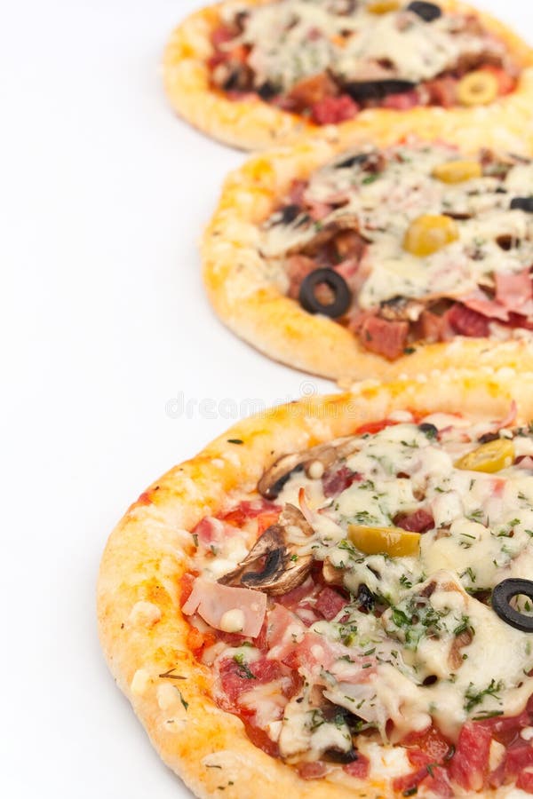 Three Mini Pizzas in a Row stock photo. Image of bacon - 39153532