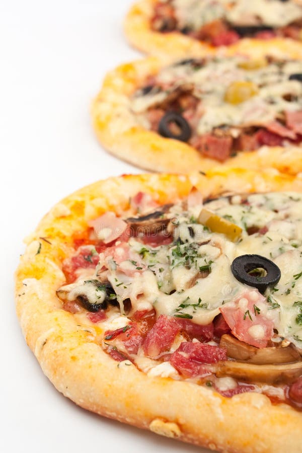 Three Mini Pizzas in a Row stock image. Image of mozzarella - 39153541