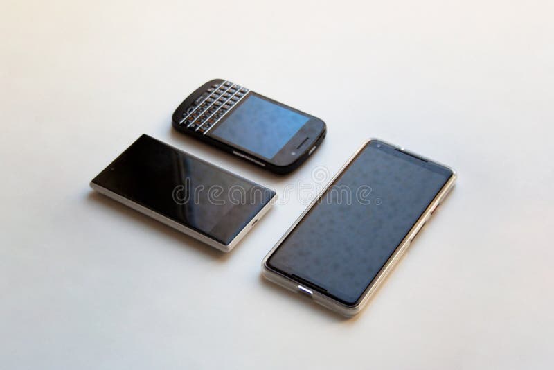 Three mobile phones stock image. Image of close, hand - 14578215