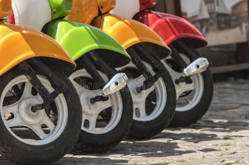 Three Mopeds Painted in Red Green Yellow Colors Stock Photo - Image of ...