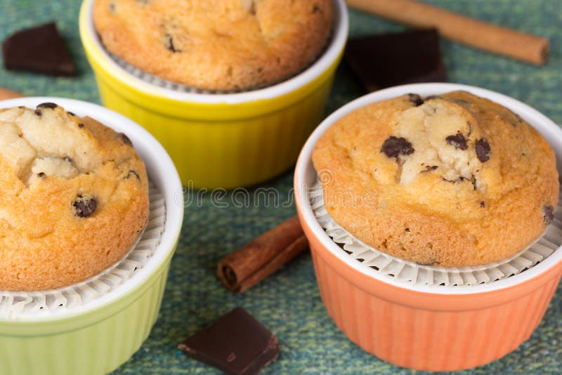 Three Muffins with Cinnamon Sticks and Chocolate Stock Image - Image of ...