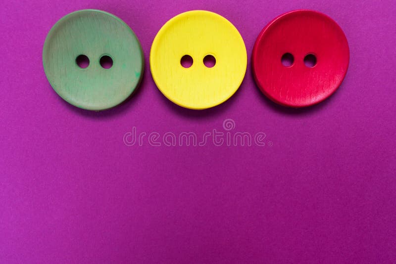 Three Large Multi-colored Buttons on a Pink Background. Copy Space ...