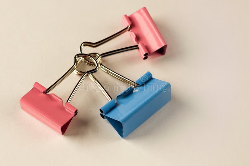 Three Multi-colored Stapled Paper Clips. Concept of Cooperation, Mutual ...