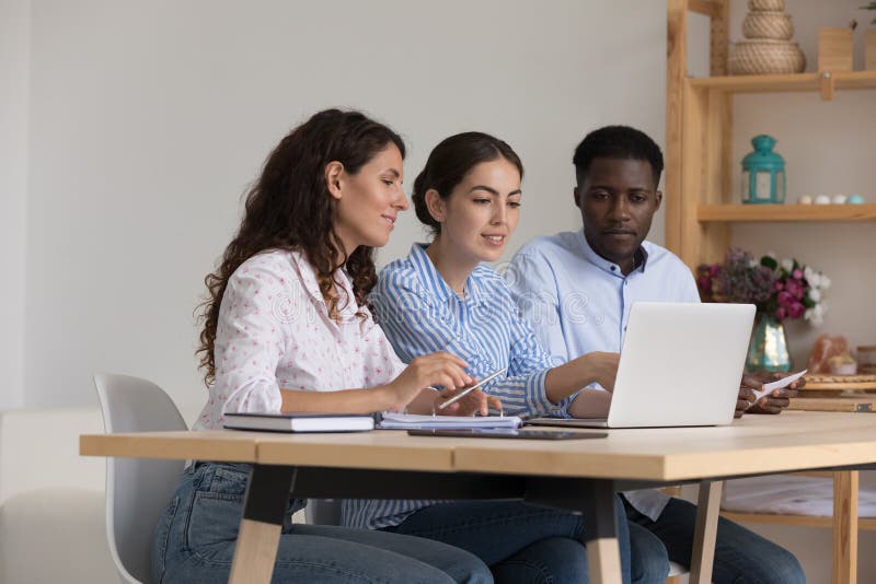 Three Multi Ethnic Employees Learning Corporate Software Using Laptop ...