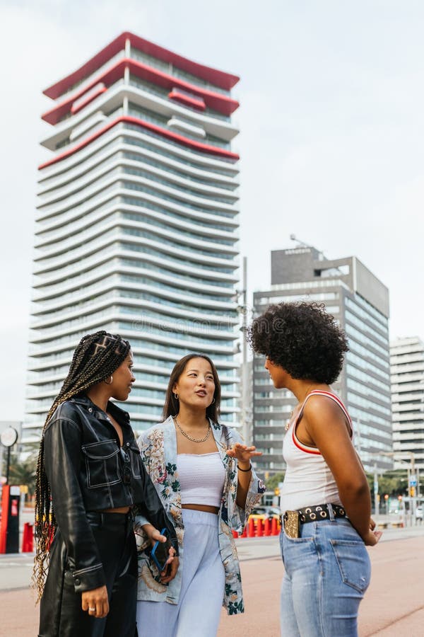 Three Multi-ethnic and Multi-gender People Talking in the City Stock ...