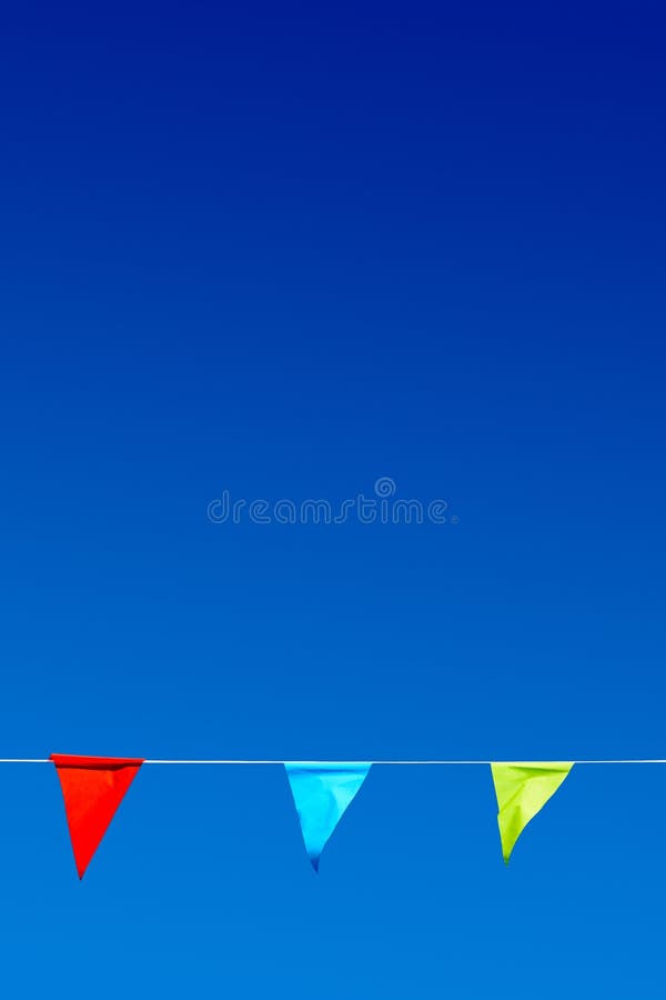 Three Multicolored Party Flags Against Blue Sky Stock Image - Image of ...