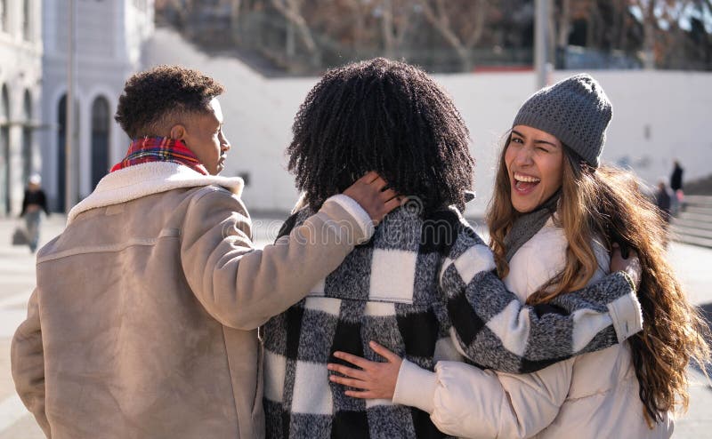 Three Multiethnic Friends are Walking Together in the City during ...