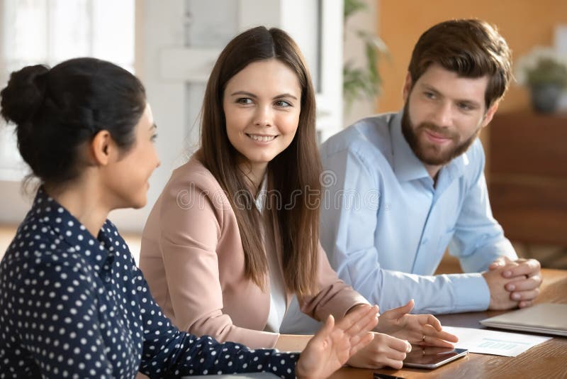 Three Multinational Teammates Lead Conversation about Work Related ...