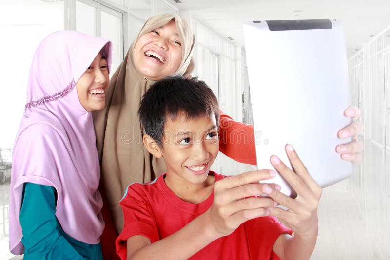 Three Muslim Kids Playing Tablet Computer Stock Image - Image of ...