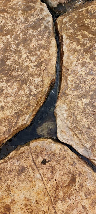 Three Natural Rocks on the Water Stock Image - Image of water, brown ...