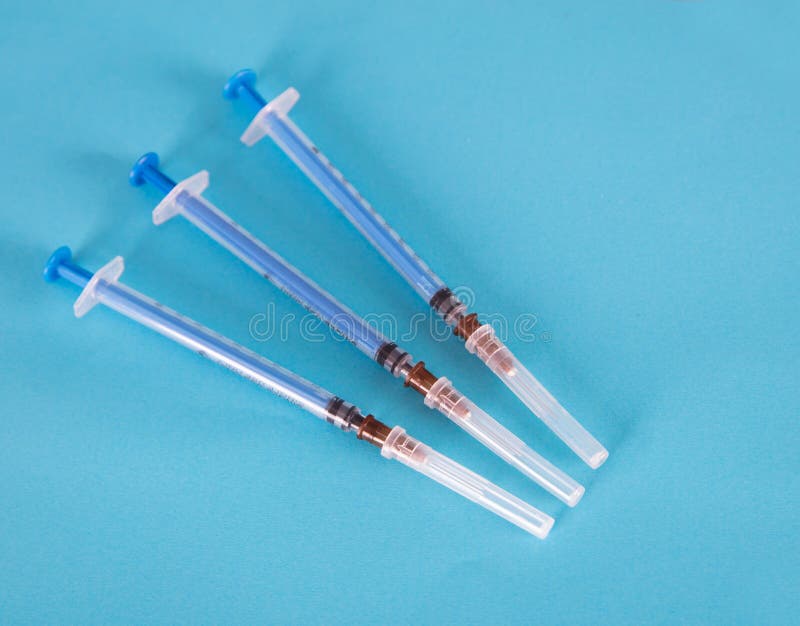 Three Needles on a Blue Background Stock Image - Image of tube ...