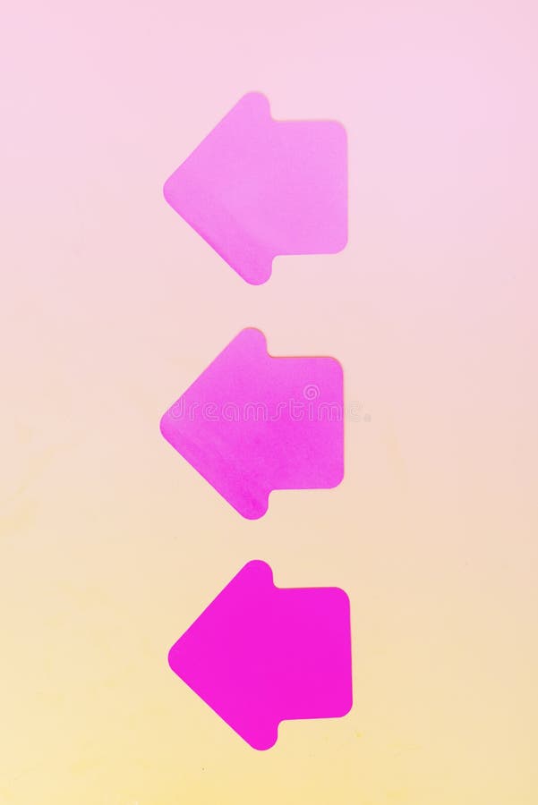 Three Neon Pink Paper Arrows on Paper Yellow Background Concept ...