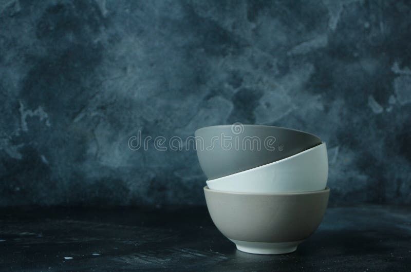 Three Neutral-colors Empty Bowls on Dark Table Stock Image - Image of ...