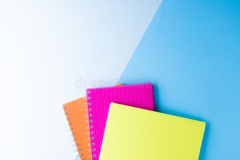 Three Notebooks with Binding and Copy Space on Blue Background Stock ...