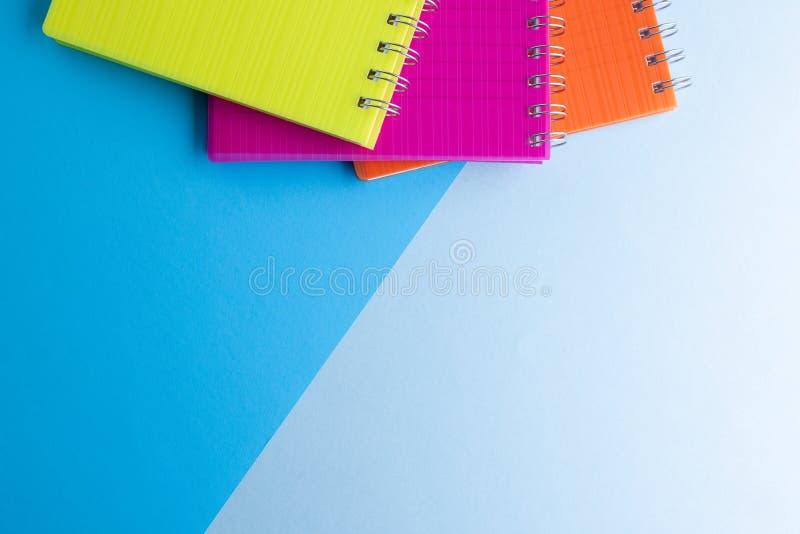 Three Notebooks with Binding and Copy Space on Blue Background Stock ...