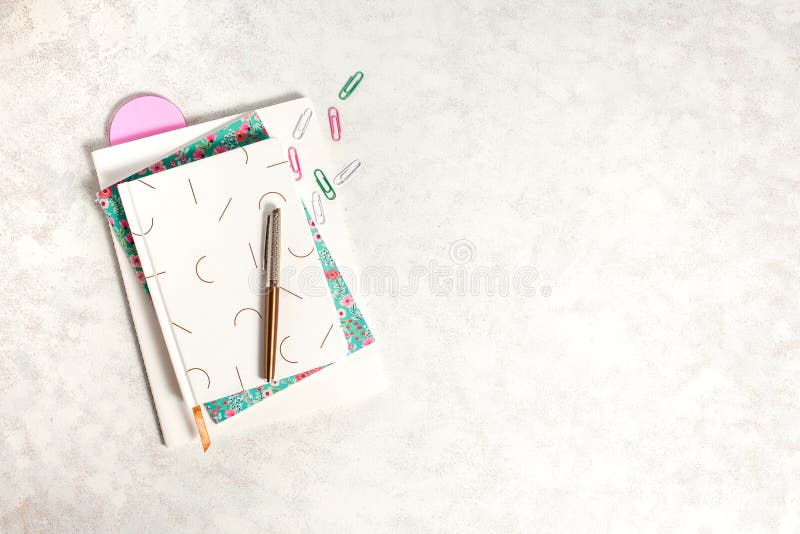 Three Notebooks On Yellow Background With Ink Pen And Copy Spaces ...