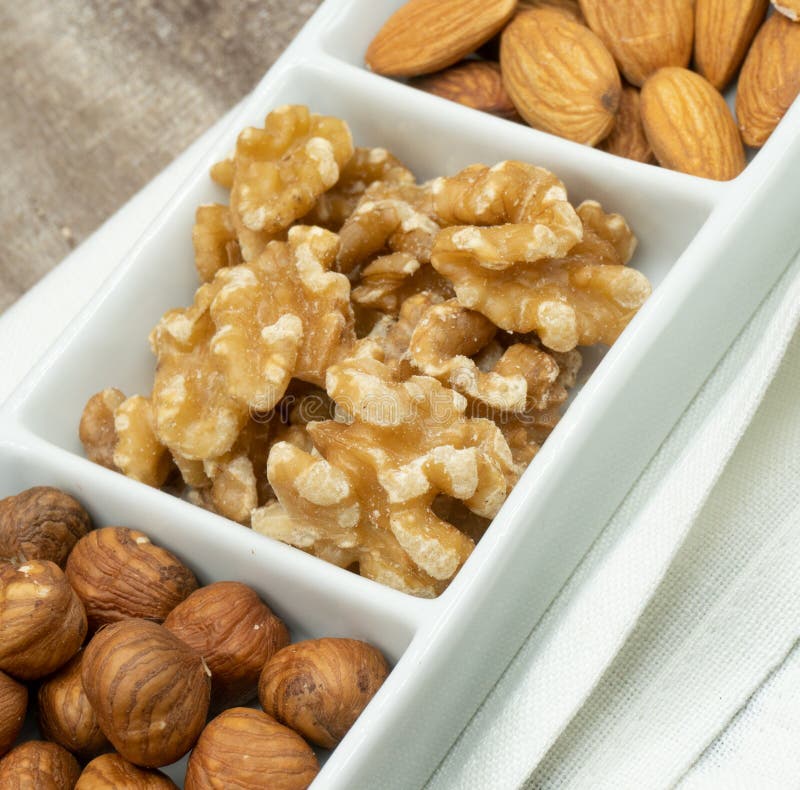 Three Nuts, Hazelnut, Almond and Walnut Stock Image - Image of ...