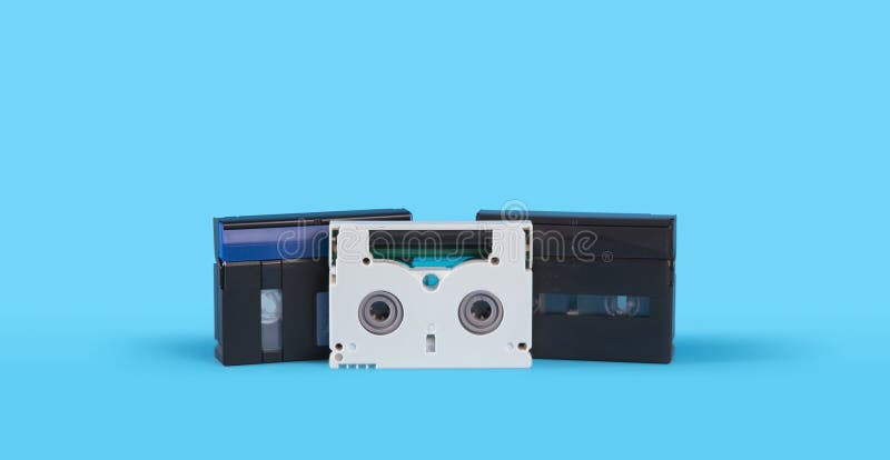Three Old Black and White Colored Mini DV Cassette on a Blue Surface ...