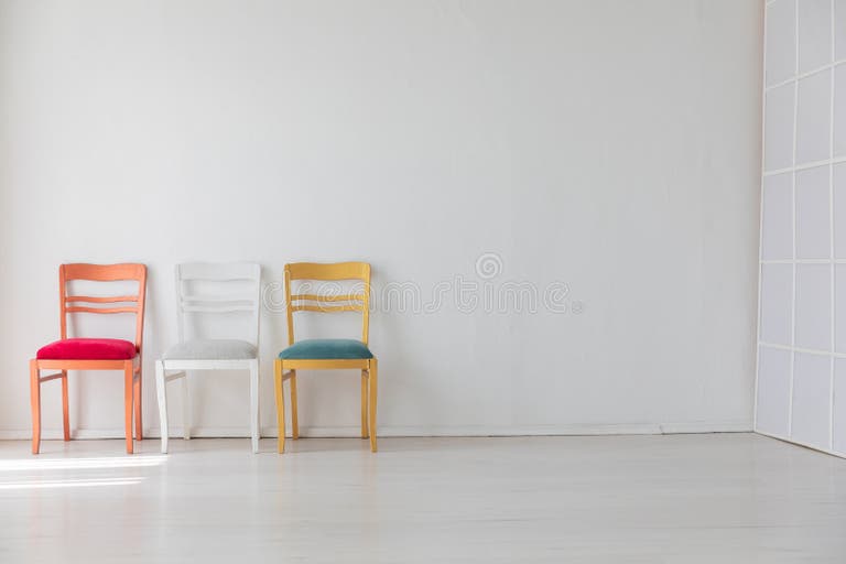 Three Old Chairs of Different Colors in the Interior of a White Room Stock Photo - Image of ...