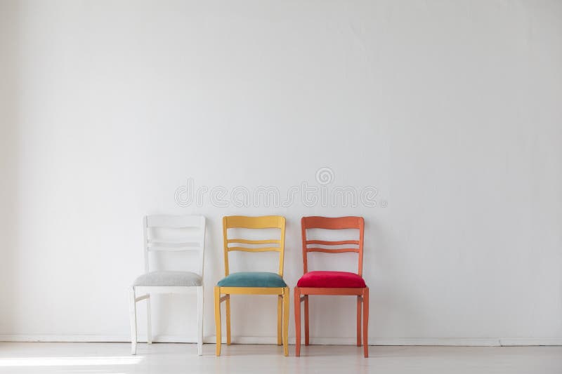 Three Old Vintage Chairs in the Interior of a White Room Stock Photo ...