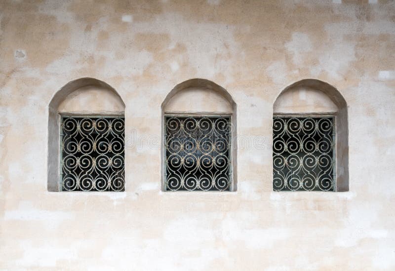 Three Old Deep Windows in Row with Iron Grating. Stock Photo - Image of ...