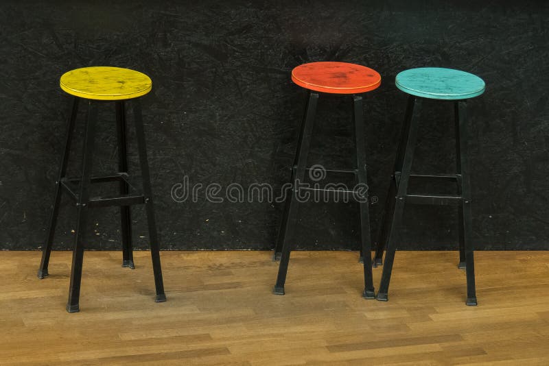 Three old style bar stools stock image. Image of wood - 130564761
