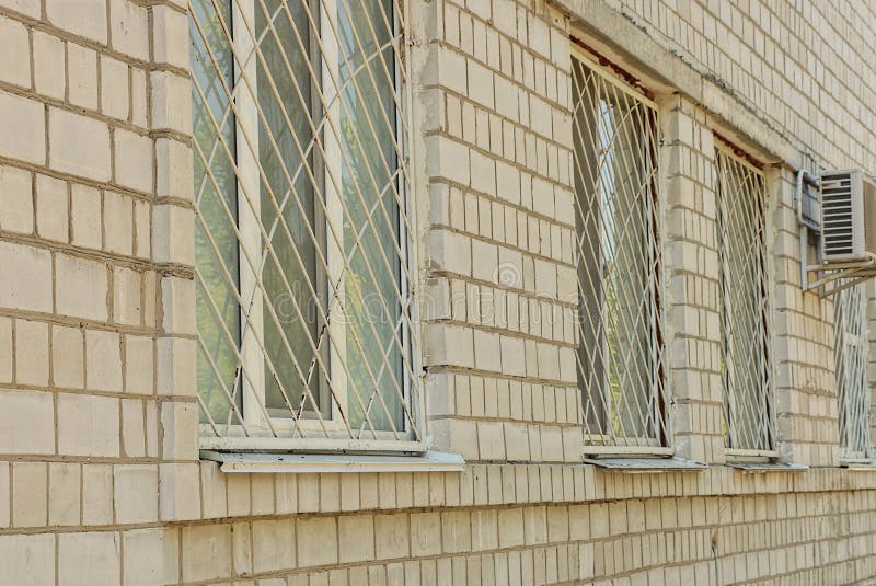 Three Old White Windows Behind an Iron Grate Stock Photo - Image of ...