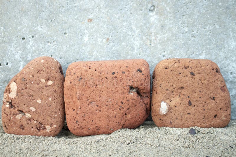 Three Orange Colored Stones on the Sand Stock Photo - Image of three ...