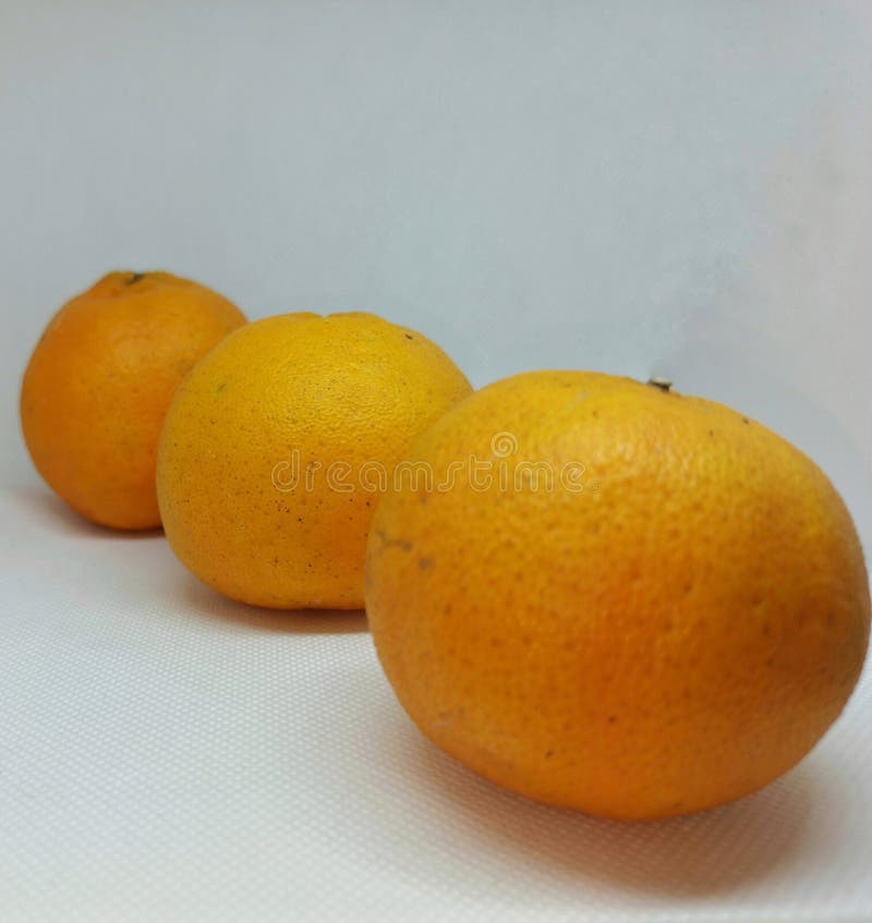 Three Oranges Put Diagonally Stock Image - Image of smaller, line ...