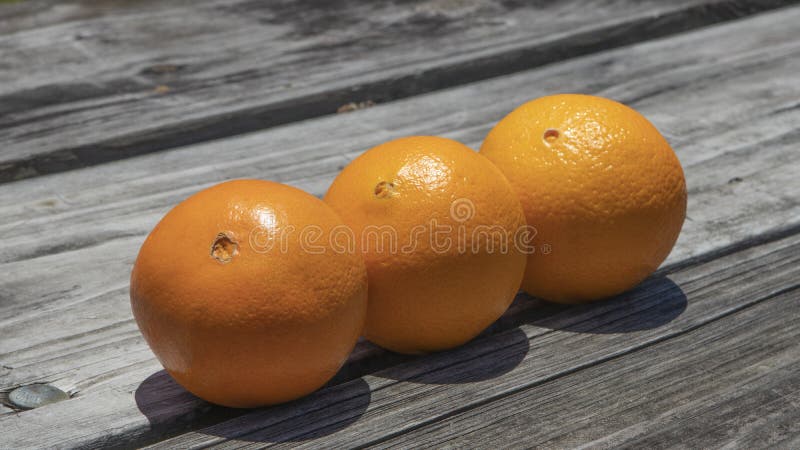 Three Oranges on a Stone Table Closeup Stock Photo - Image of freshness ...