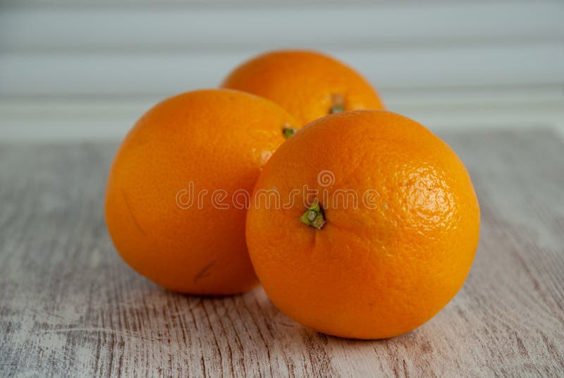 Three Oranges on White Wooden Background Stock Image - Image of wood ...