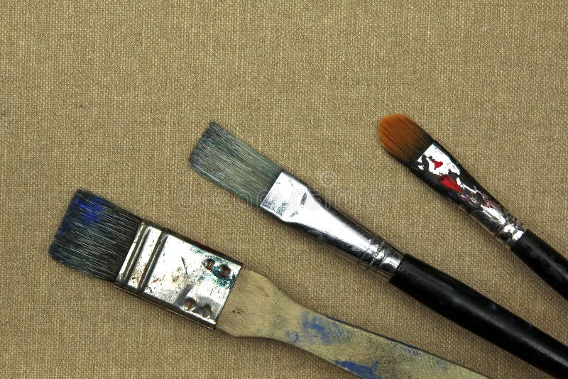 Three Paint Brushes on Canvas Stock Image - Image of creative, hobby ...