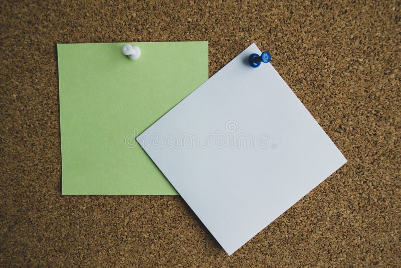 Three Paper Notes Green, White and Yellow Color on a Cork Board ...