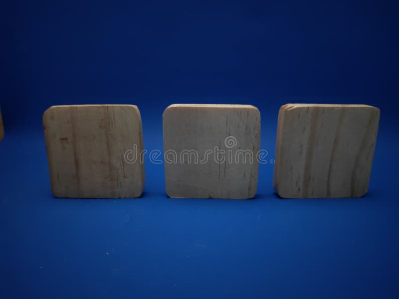 Three Parallel Square Wooden Blocks Stock Image - Image of lighting ...