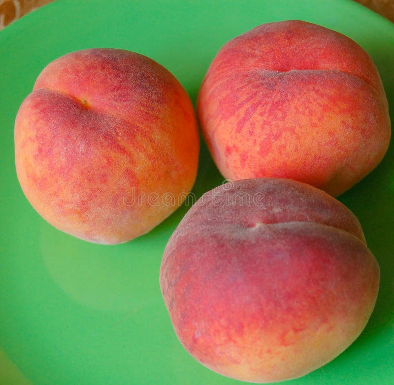Three Peaches on a Green Plate. Stock Image - Image of three, ripe ...