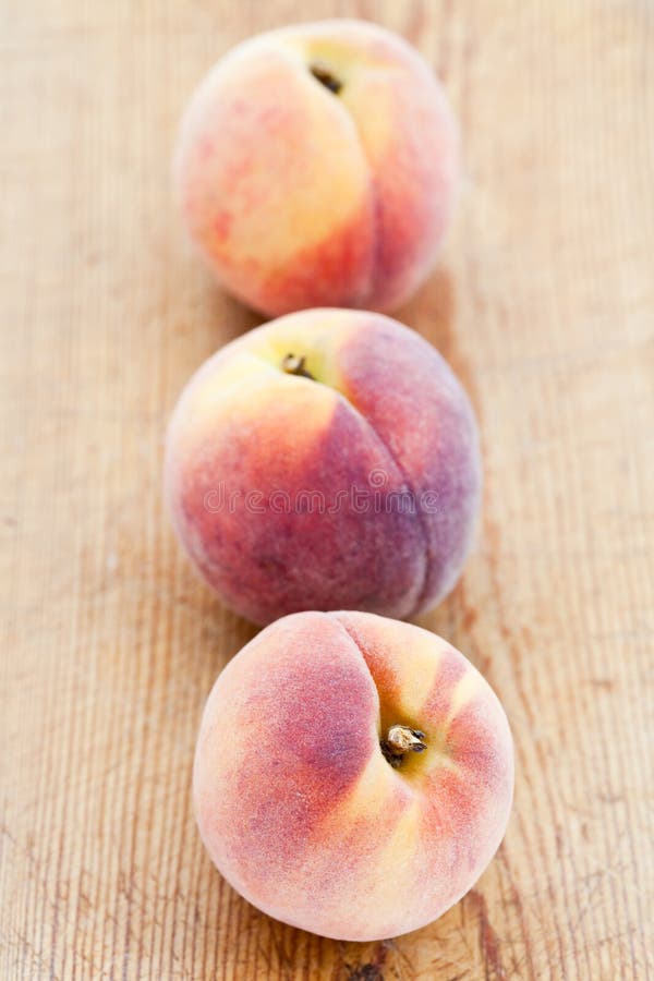 Three peaches in a row stock photo. Image of ripe, meal - 13457556