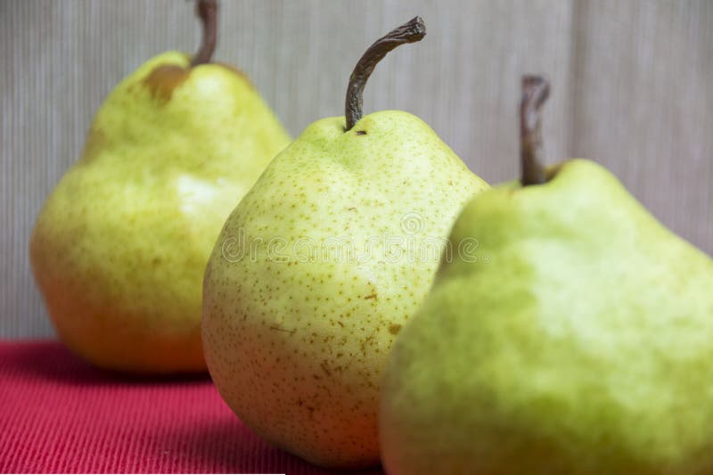 Three pears stock image. Image of snack, yellow, green - 42423477