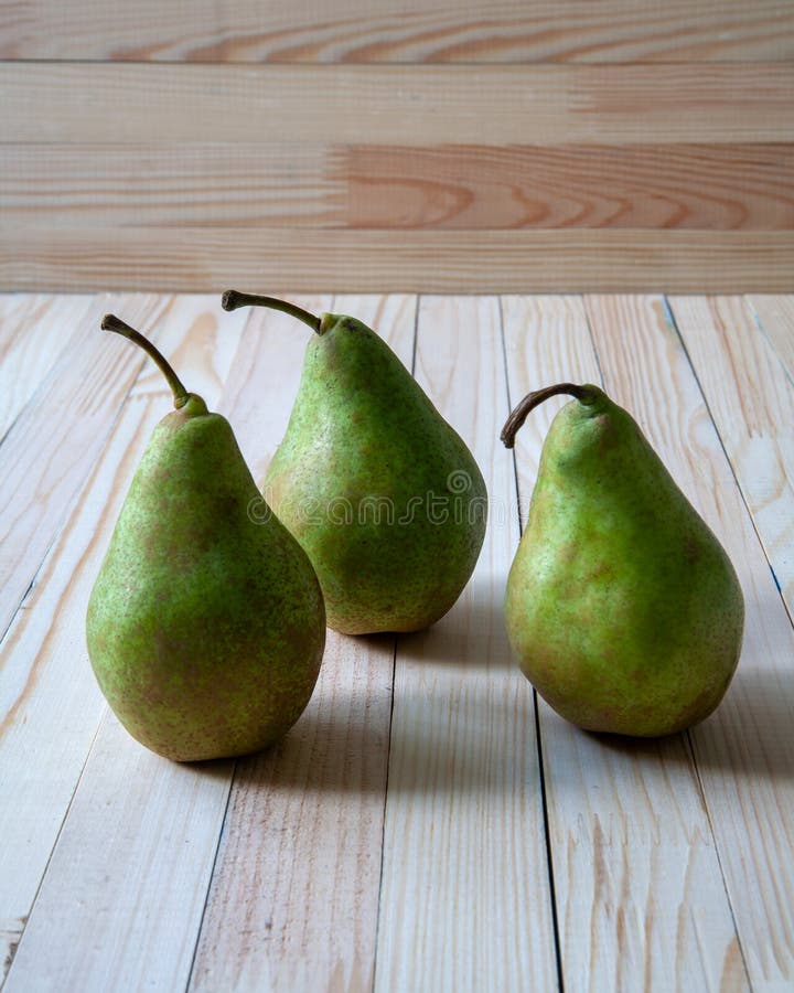 Three Pears Lie on a Wooden Table. Stock Image - Image of healthy ...