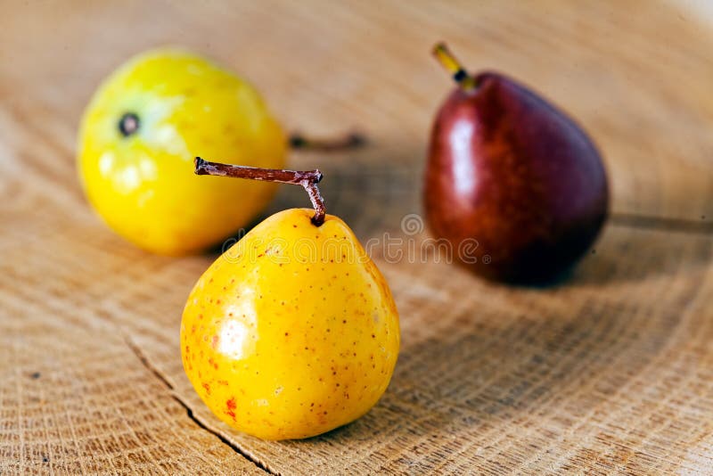 Three pears on the log stock image. Image of health, organic - 72823121