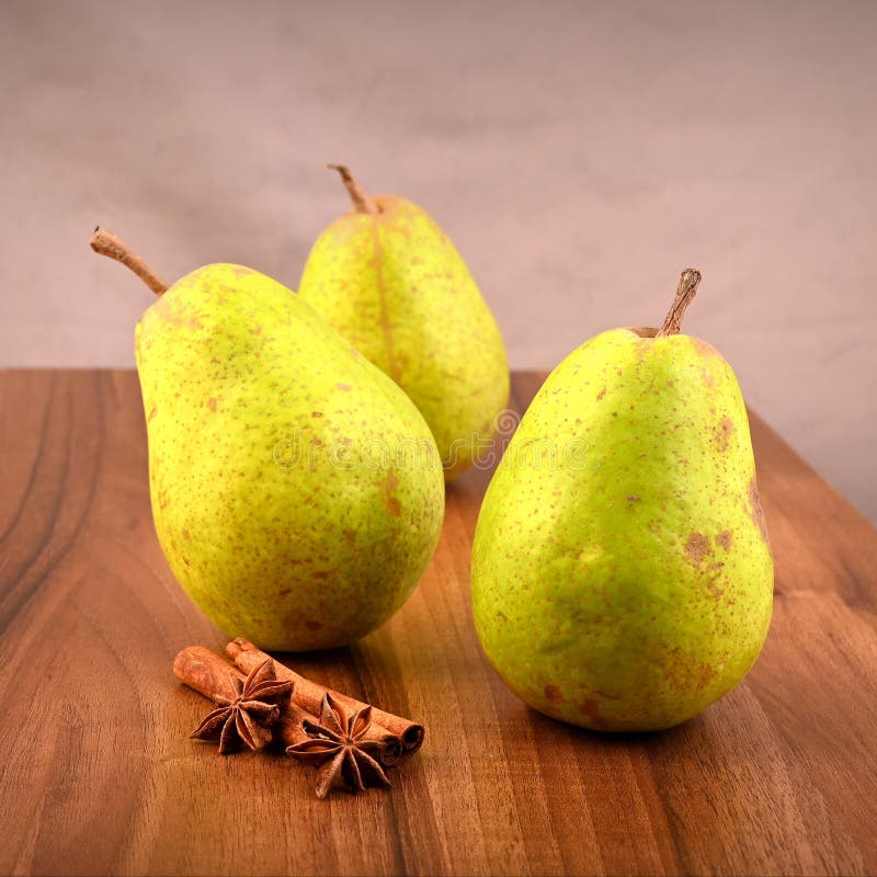 Three Pears on Wooden Table. Stock Photo - Image of pear, tropical ...