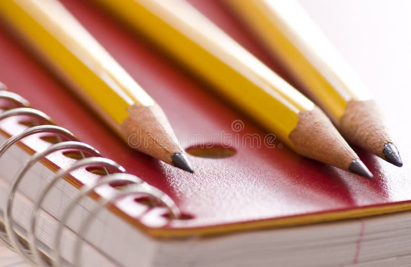 Three Pencils on Notebook stock photo. Image of school - 6080936