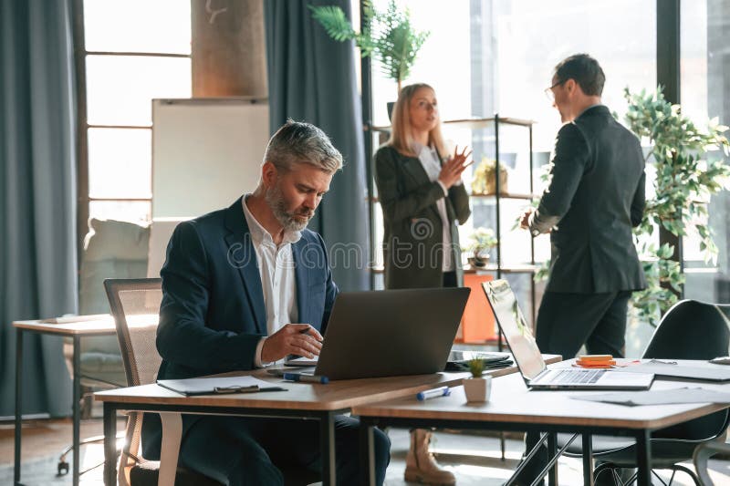 Three People are Busy in the Office. Group of Employees are Working ...