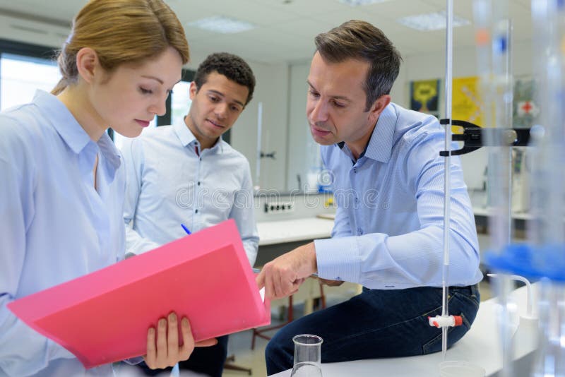 Three People in Discussion in Science Laboratory Stock Image - Image of ...