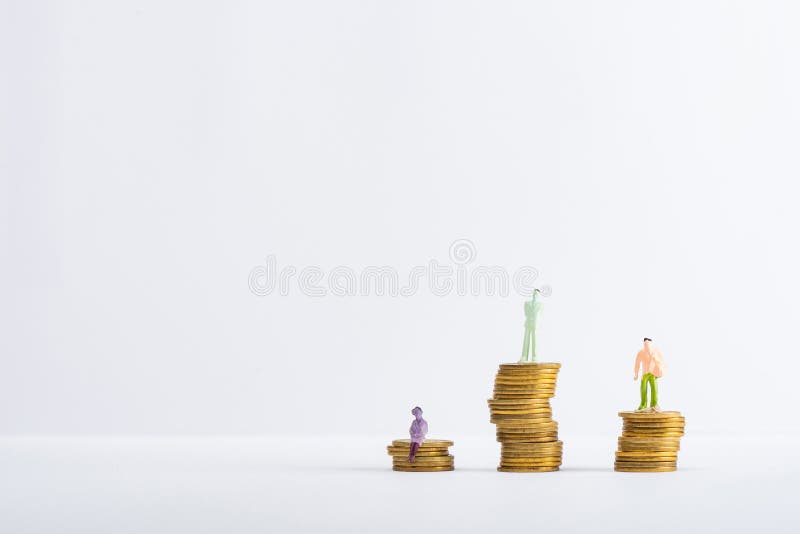 Three People Figures on Stacked Coins on White Surface Isolated on Grey ...