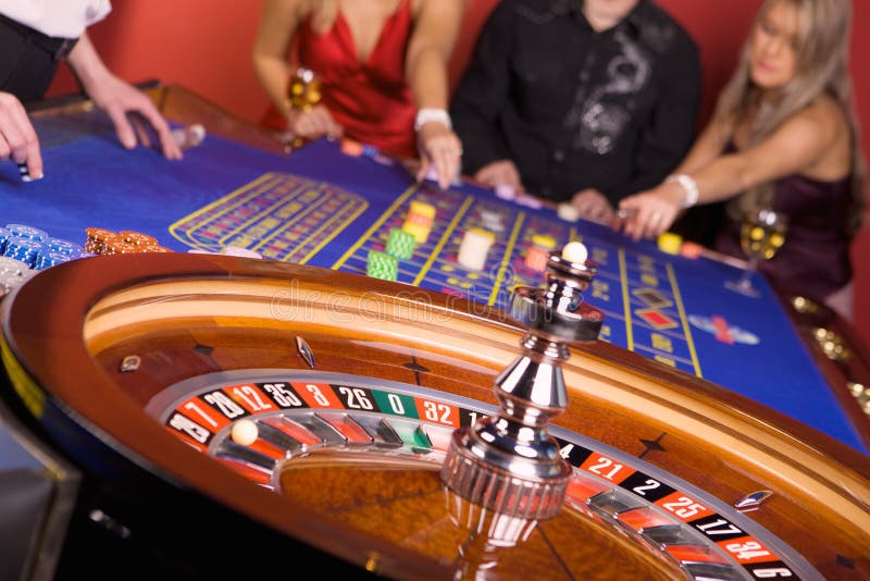 Three People Playing Roulette Stock Image - Image of gambler, glamour ...