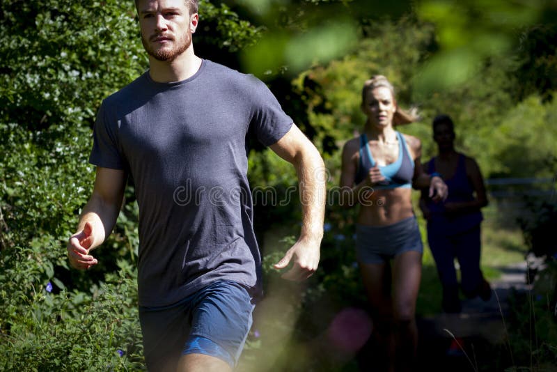 Three People Running stock photo. Image of marathon, outdoors - 73207864